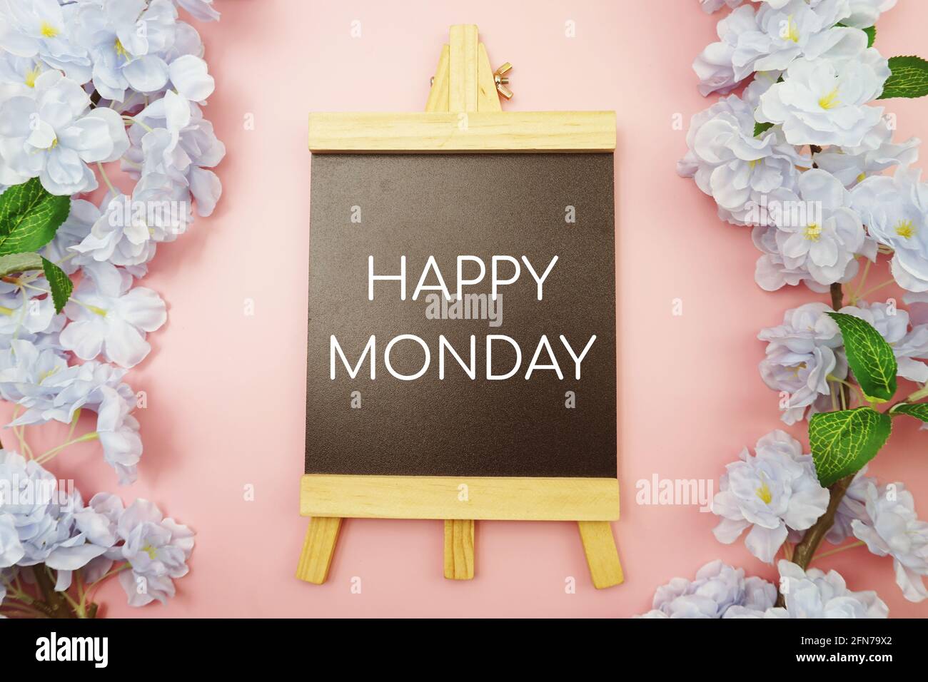Happy Monday text with Blooming flowers on pink background Stock Photo ...