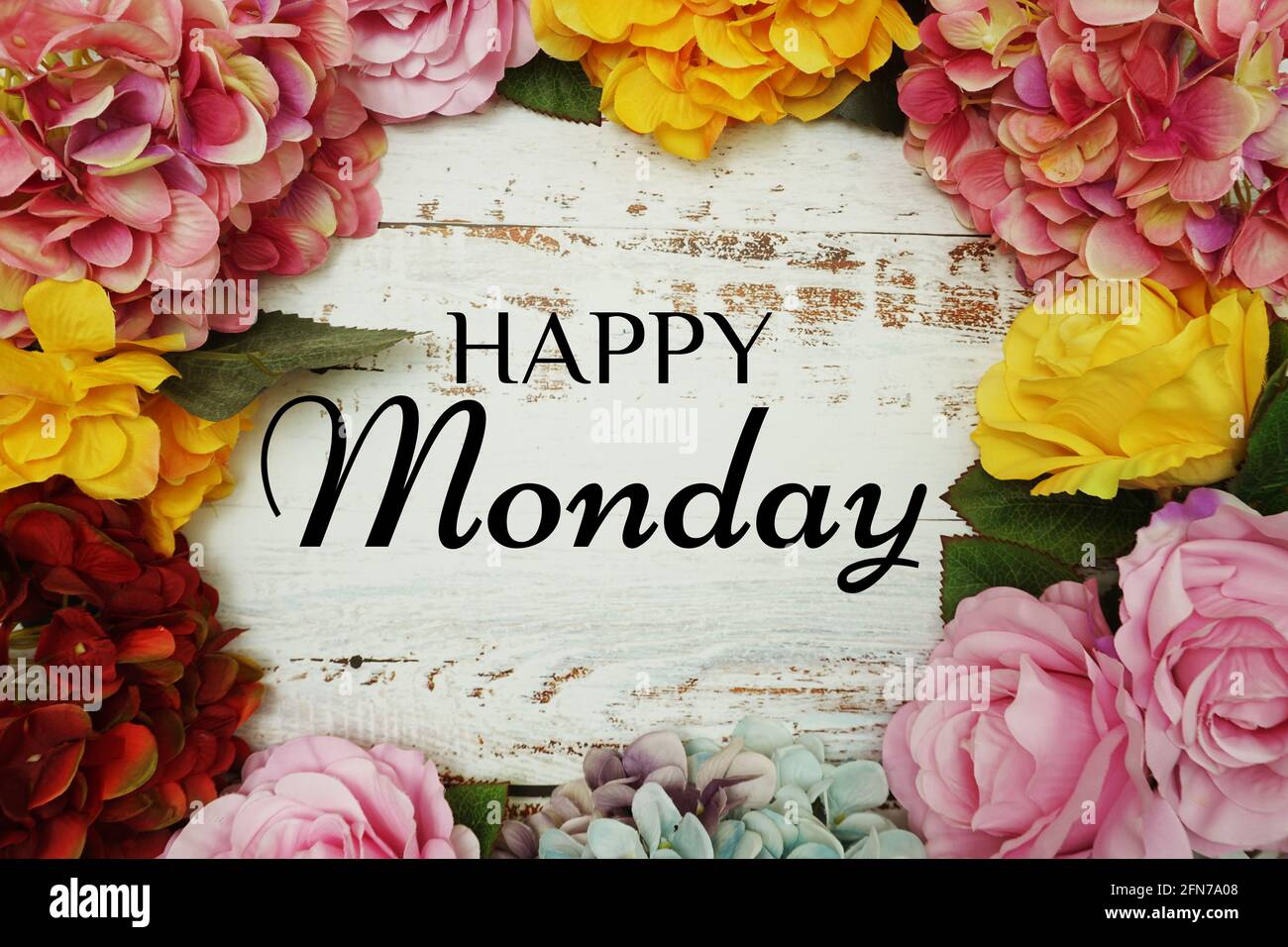 Happy Monday text and Flowers Colorful Border Frame on wooden ...