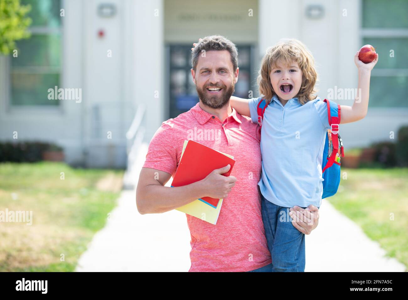 Portrait of happy father and son come back from school Stock Photo - Alamy