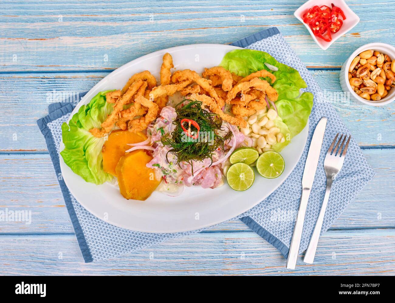 Peruvian food: fish ceviche and chicharron de pescado with fried ...