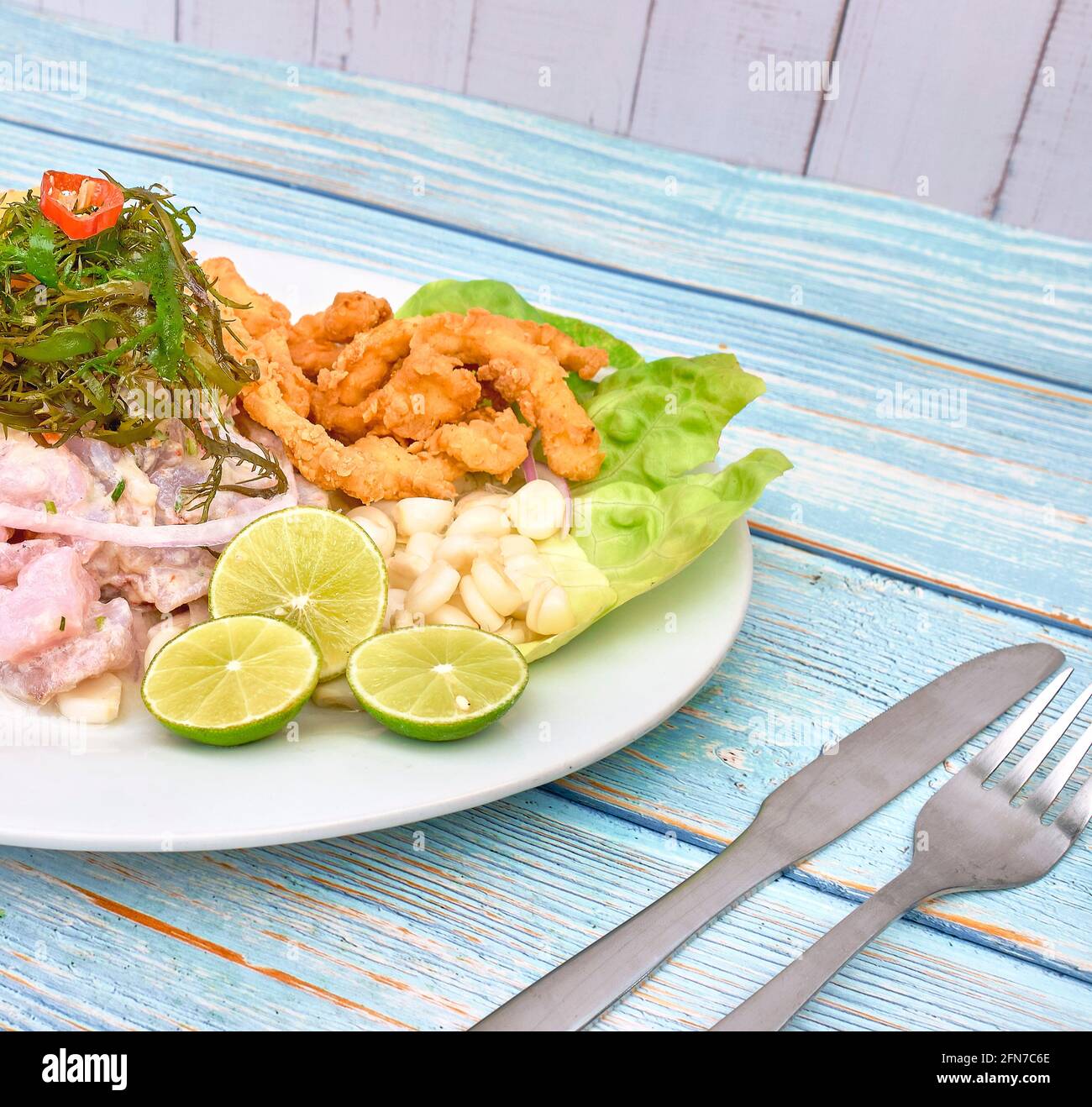 Peruvian food: fish ceviche and chicharron de pescado with fried ...