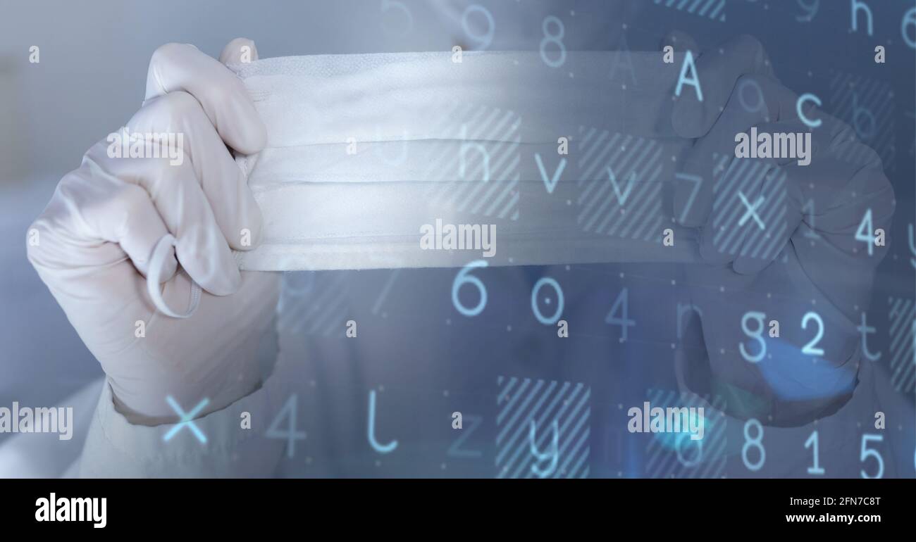 Composition of medical data processing over doctor holding face mask ...