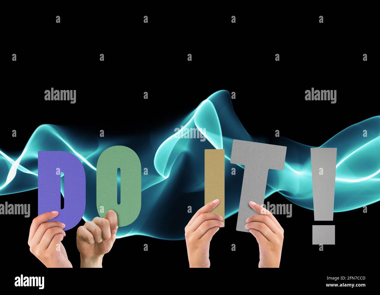 Composition of do it text in multi coloured letters held by people with ...