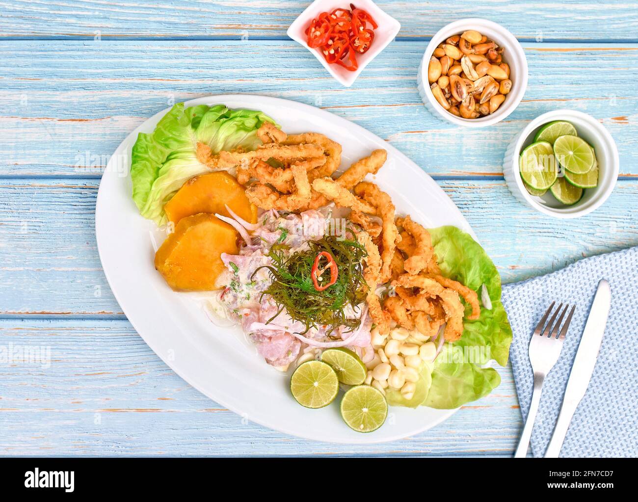 Peruvian food: fish ceviche and chicharron de pescado with fried ...