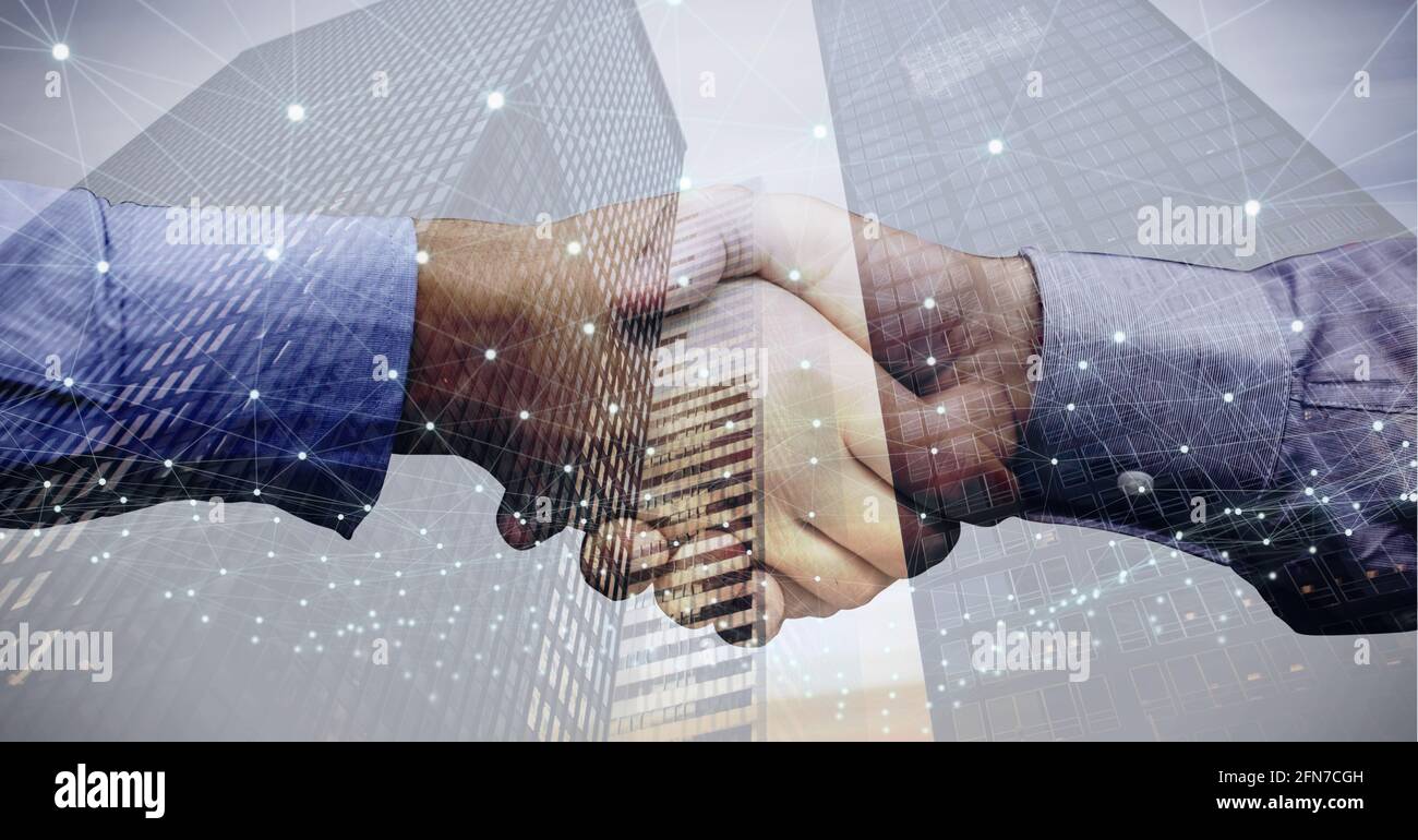 Network of connections over mid section of two businessmen shaking ...