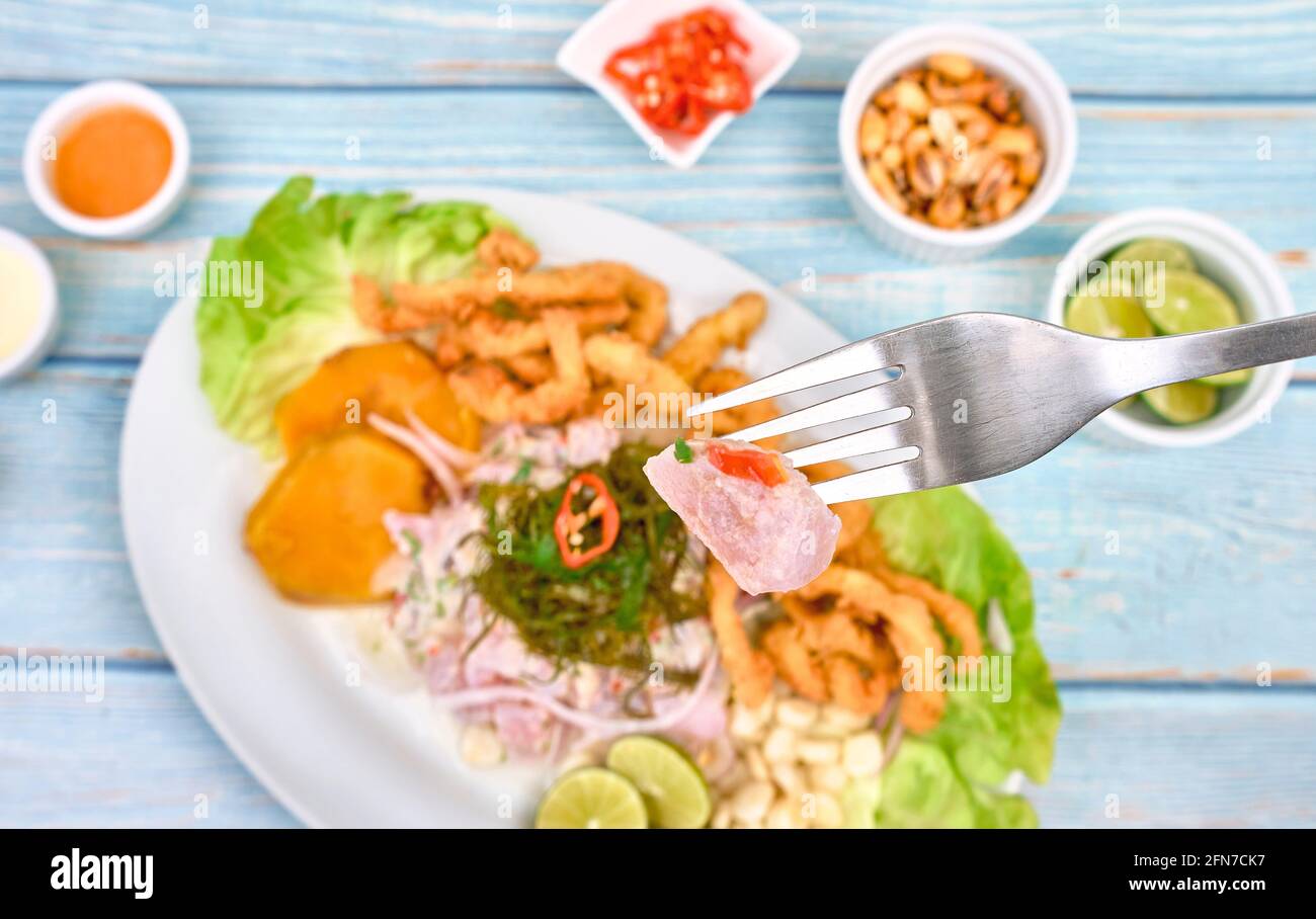 Peruvian food: fish ceviche and chicharron de pescado with fried ...