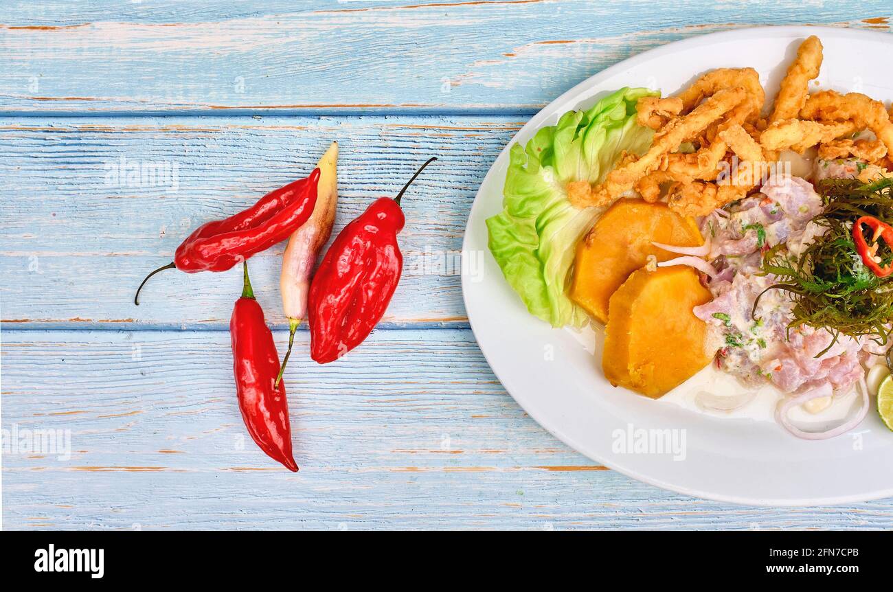 Peruvian food: fish ceviche and chicharron de pescado with fried ...