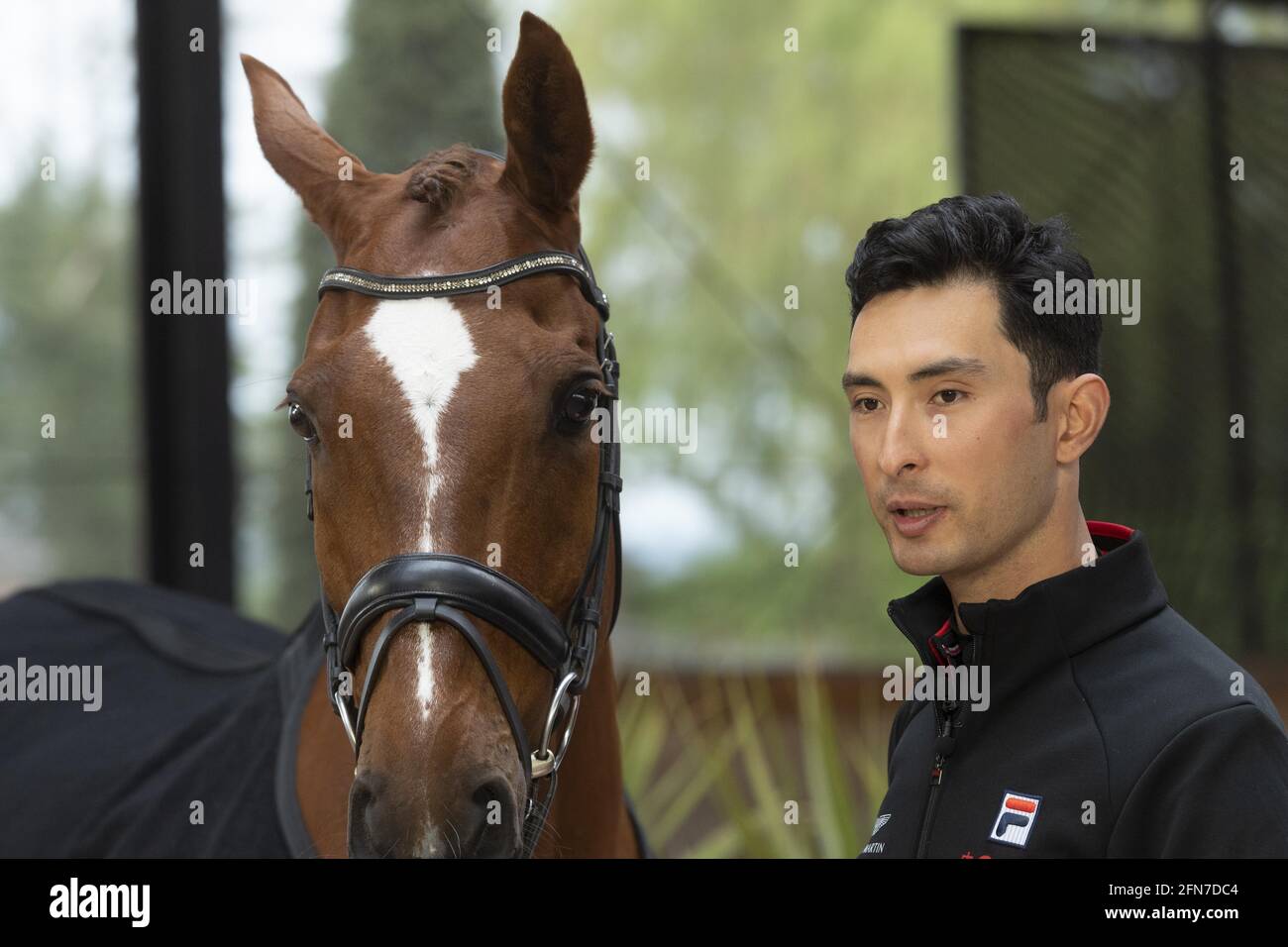 Cheshire, Britain. 14th May, 2021. Alex Hua Tian stands next to his ...