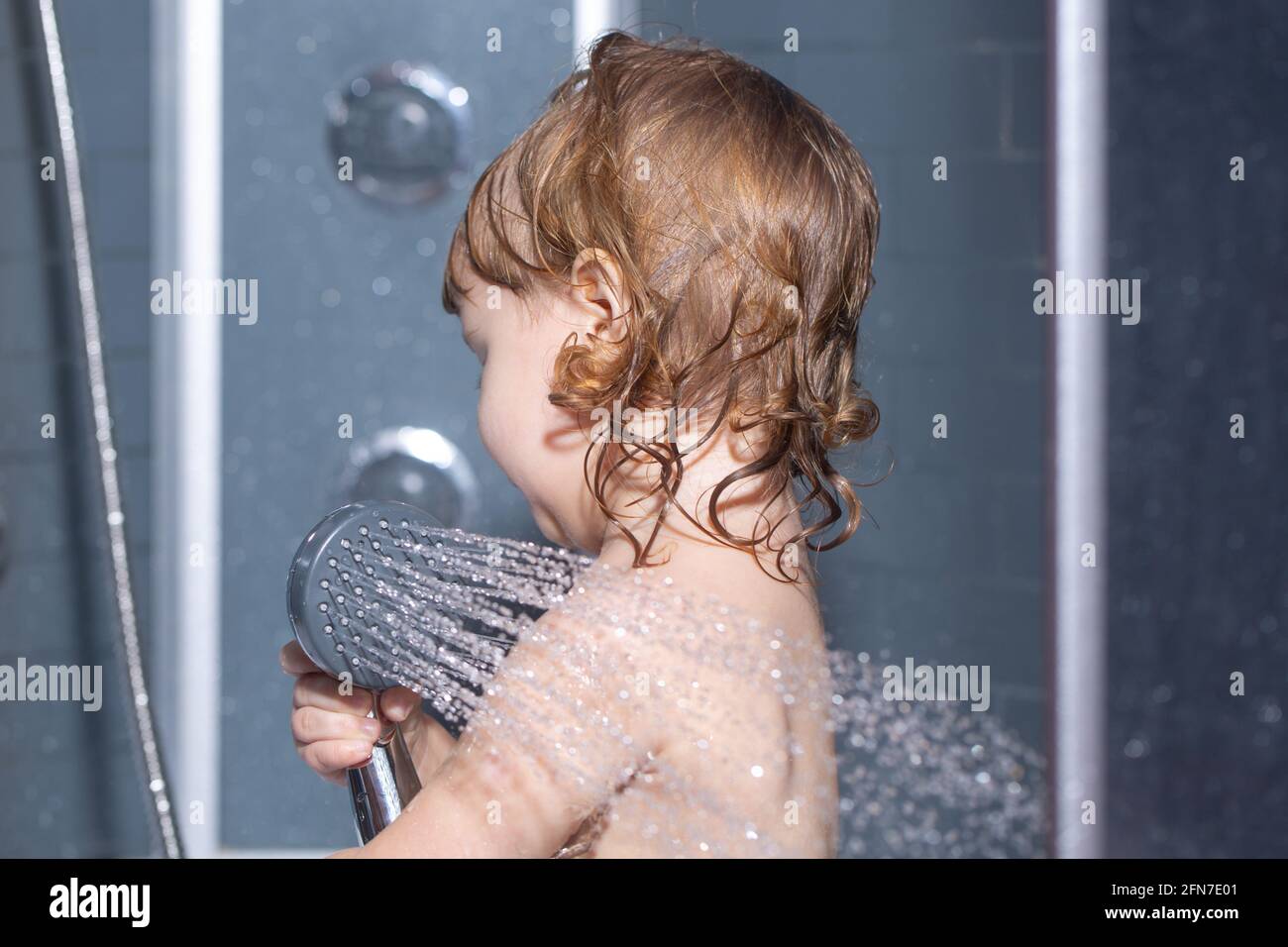 Children splashing water in the bathroom hi-res stock photography and ...