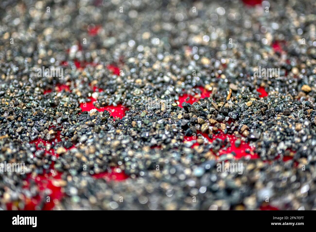 Vibrating screen, ore washing with liquid. Lots of small stones on the ...