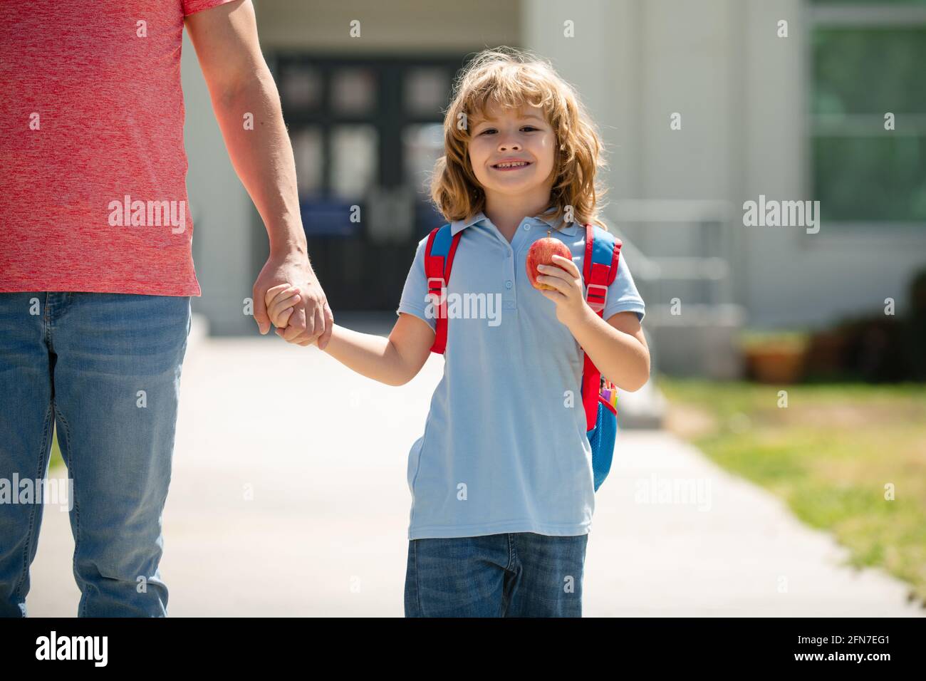 Children outside school building backpack hi-res stock photography and ...