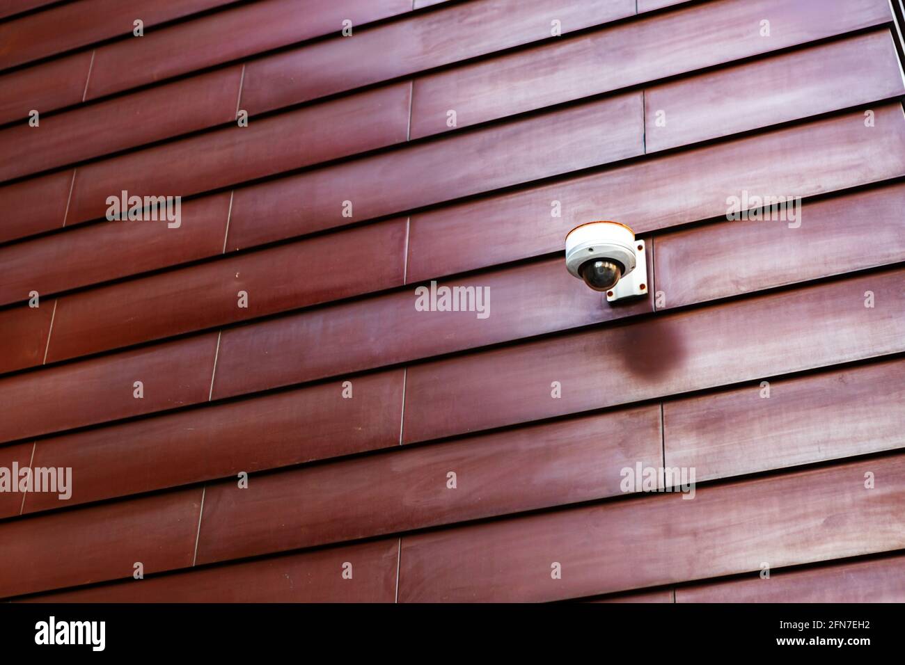 Security CCTV camera on facade of building Stock Photo - Alamy