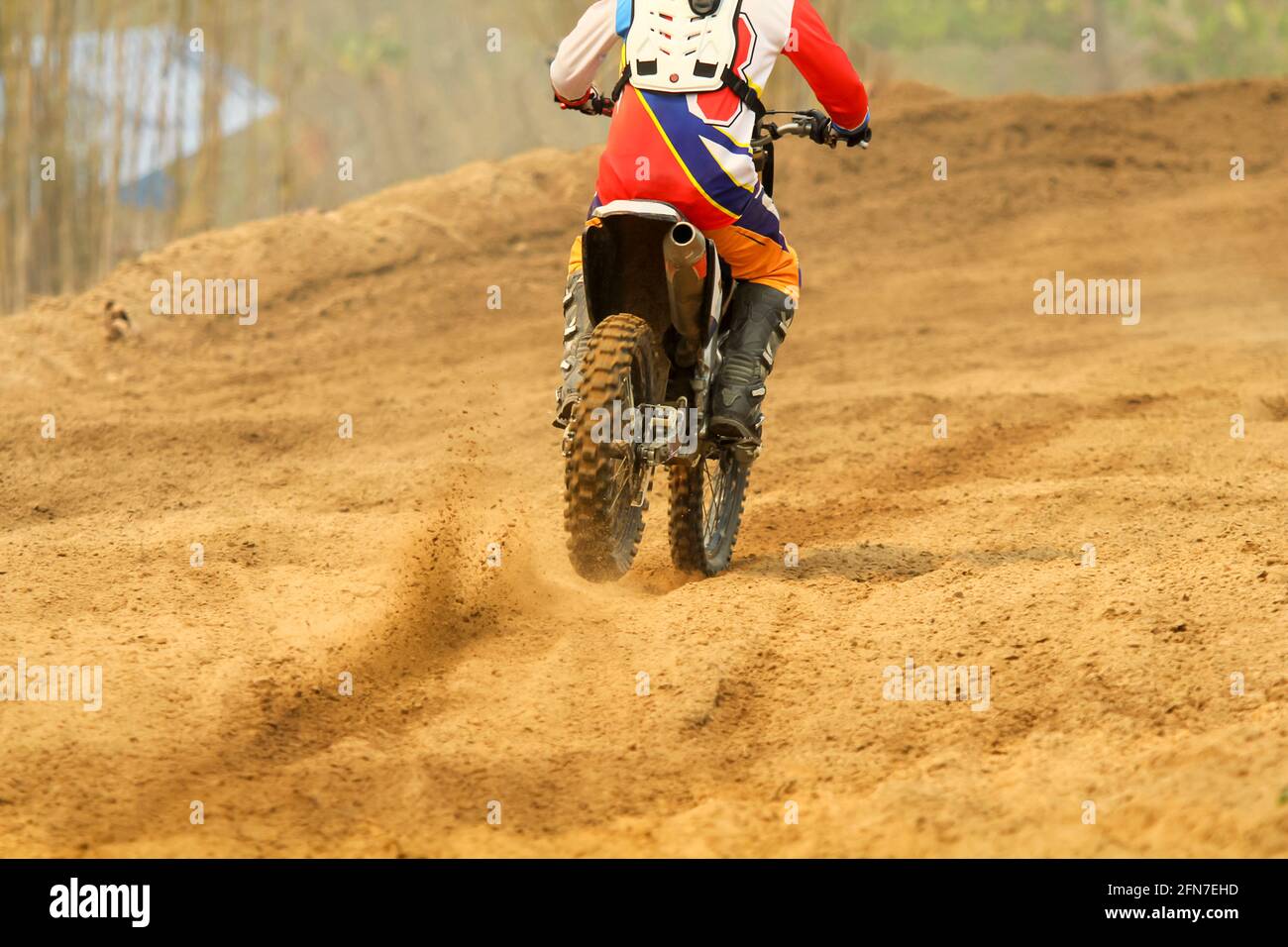Motocross racer accelerating speed in track Stock Photo - Alamy