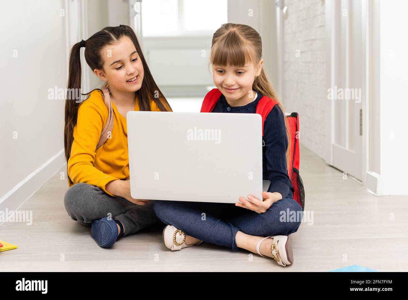 Distance learning online education. Schoolgirls with laptop notebook ...