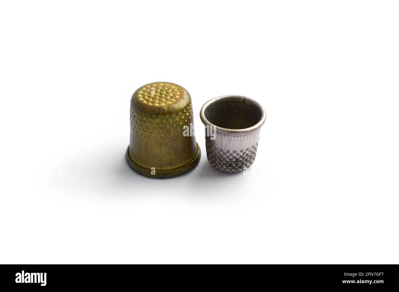 Two vintage thimbles isolated on a white background with shadow Stock ...
