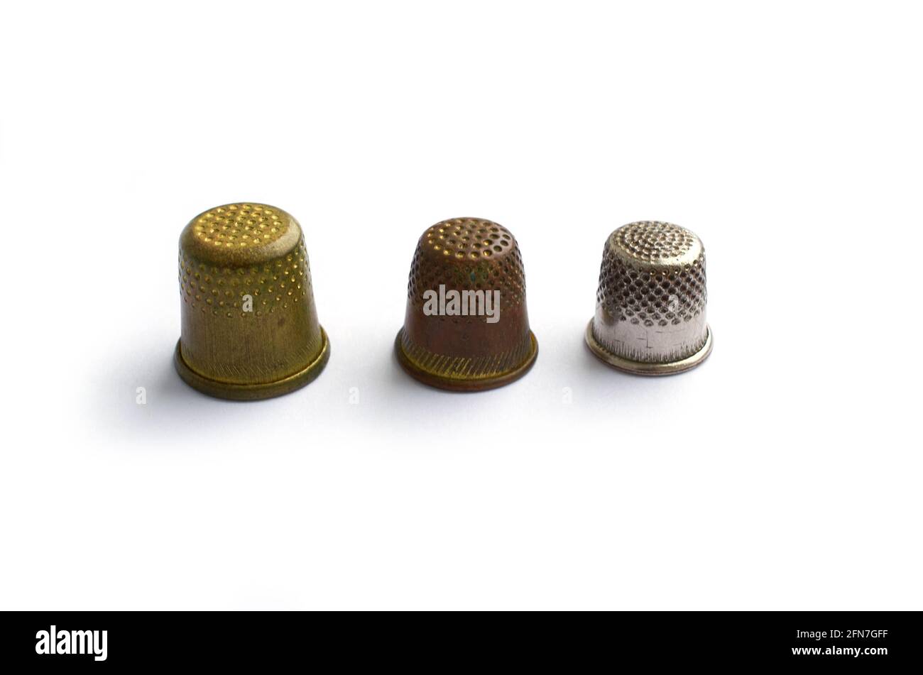 Three vintage thimbles isolated on a white background with shadow Stock ...