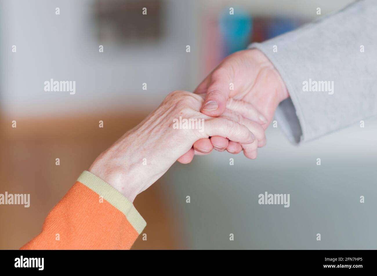 Hand senior citizen holding hi-res stock photography and images - Alamy
