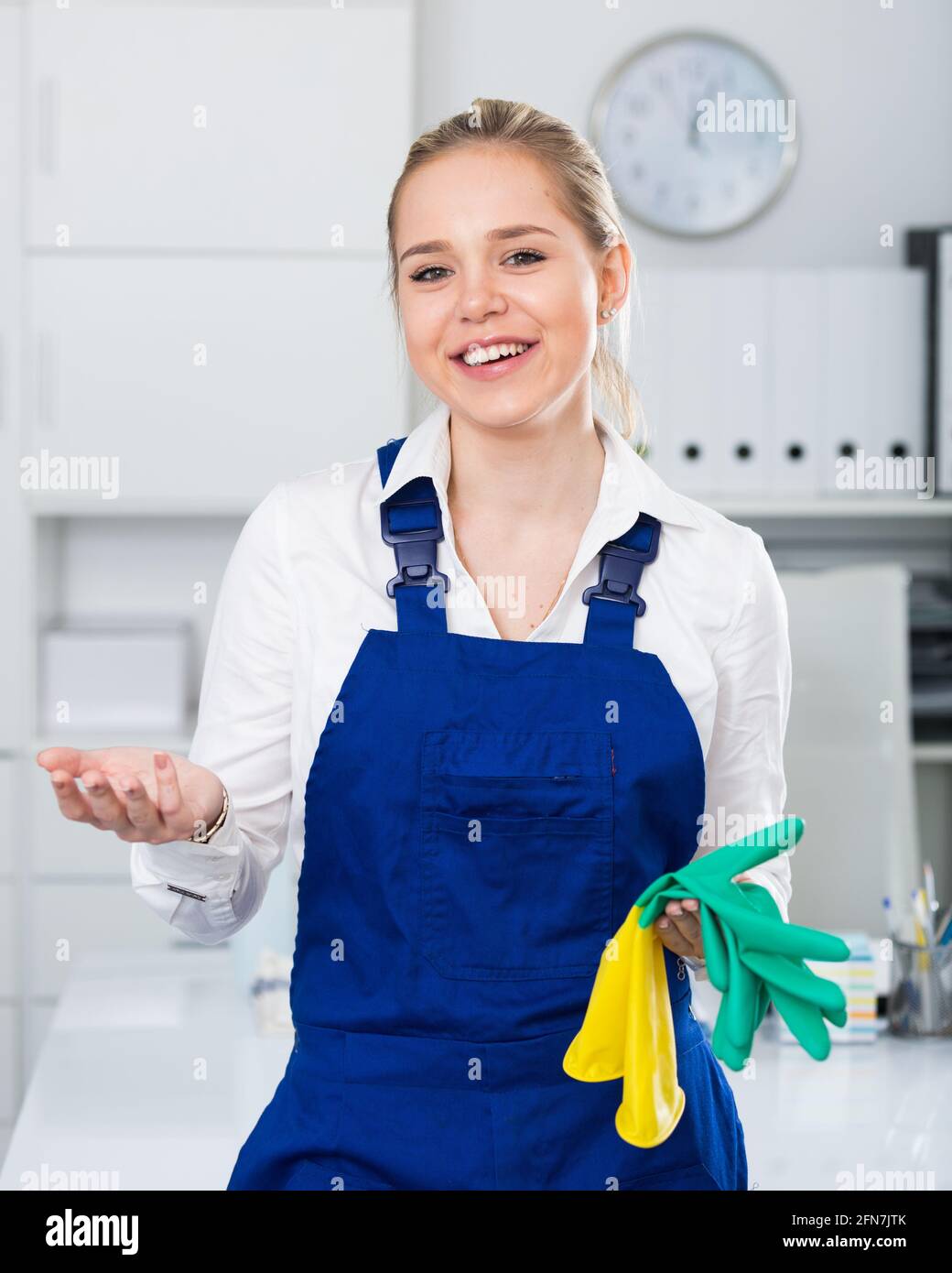 Girl in overall ready to cleaning Stock Photo - Alamy