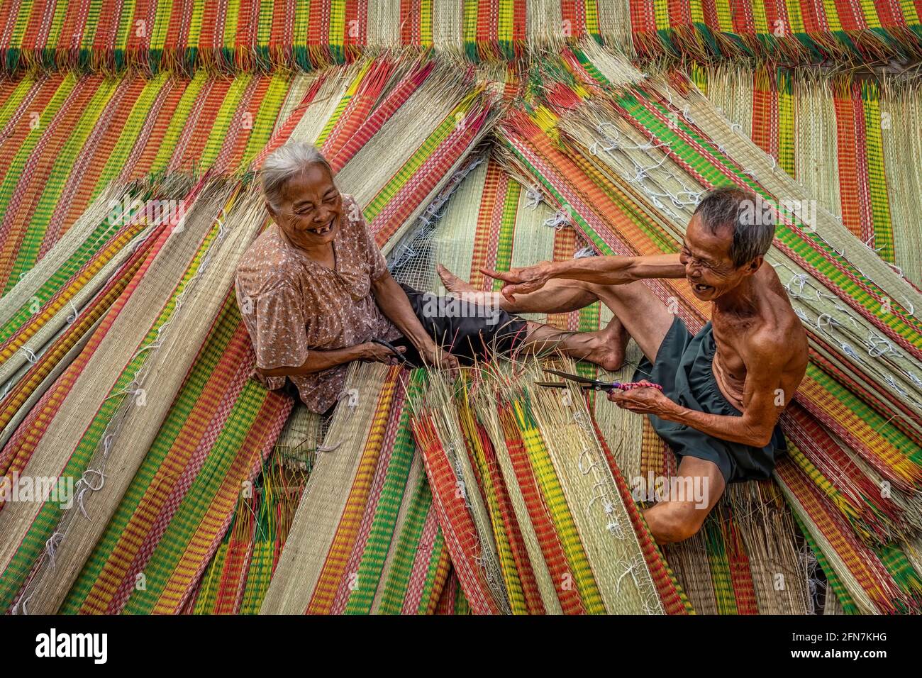 Top view of old Vietnamese lover craftsman making the traditional ...