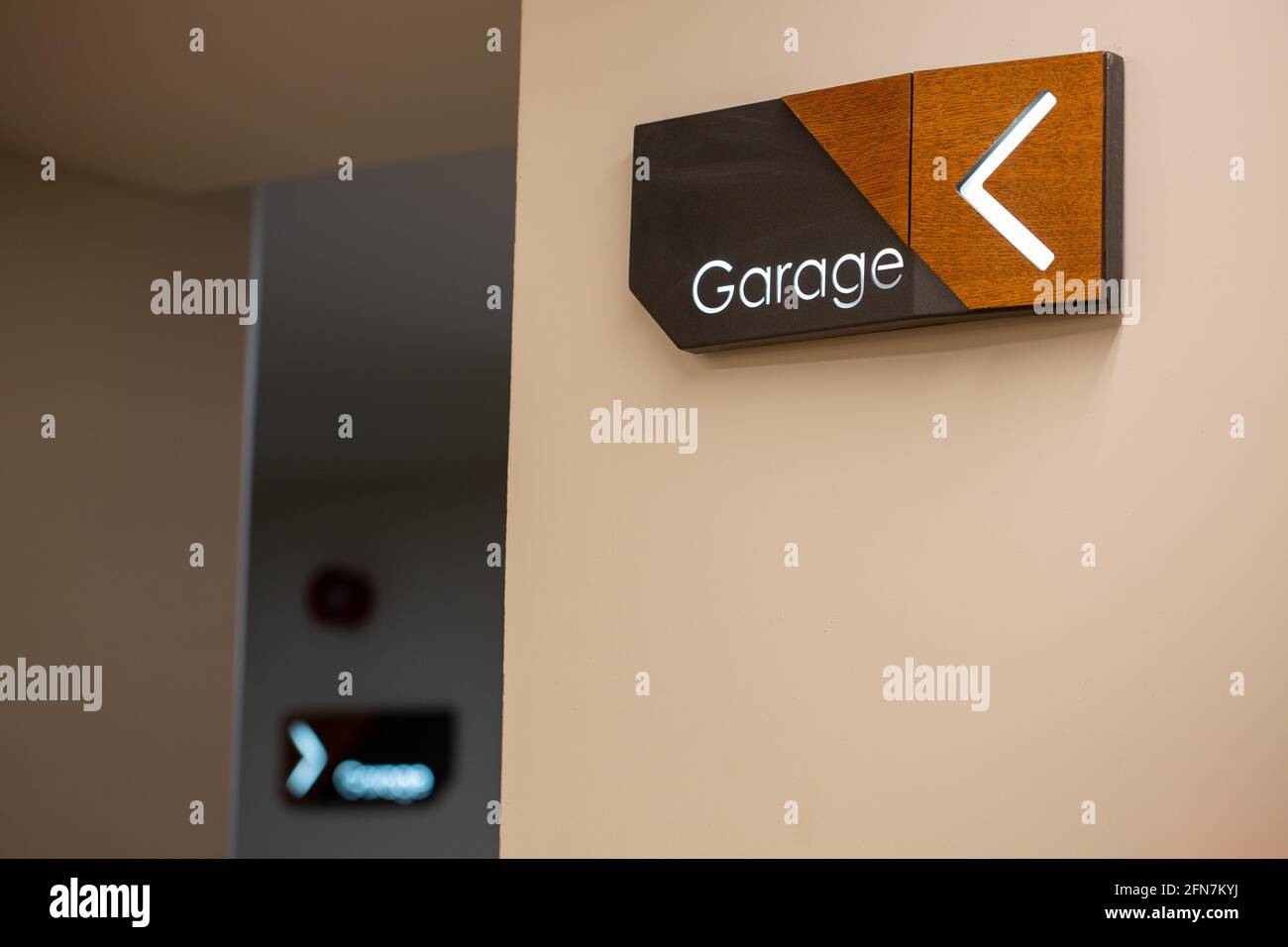 Closeup of Garage signage with an arrow sign showing the direction ...