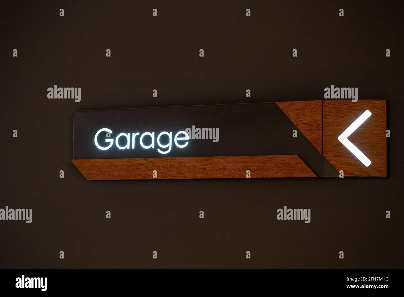 Closeup of Garage signage with an arrow sign showing the direction ...