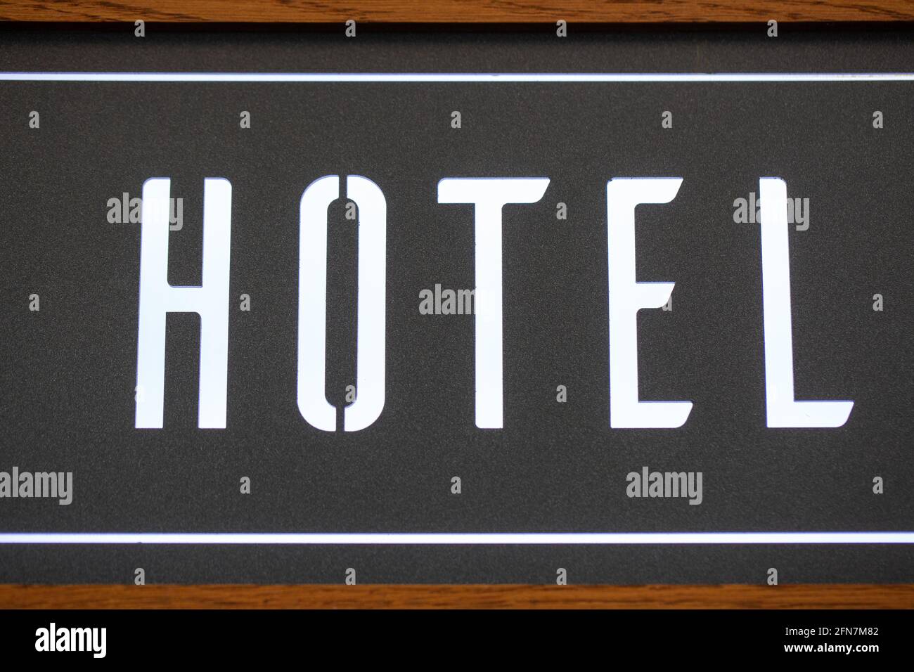 Closeup of HOTEL signage against the wall Stock Photo - Alamy