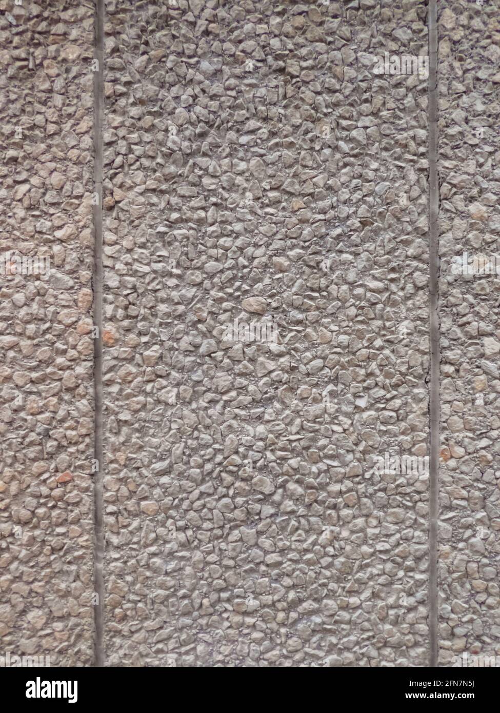 Granulated stone wall texture with a vertical parting line Stock Photo ...