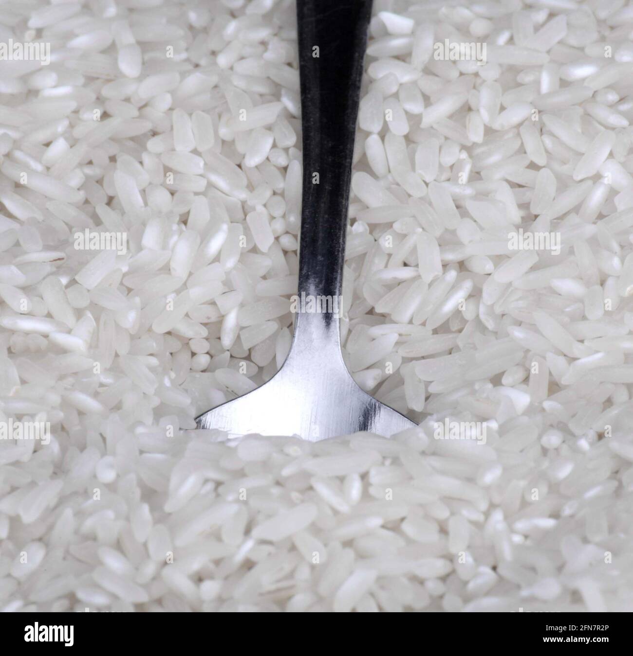 rice background and teaspoon Stock Photo - Alamy
