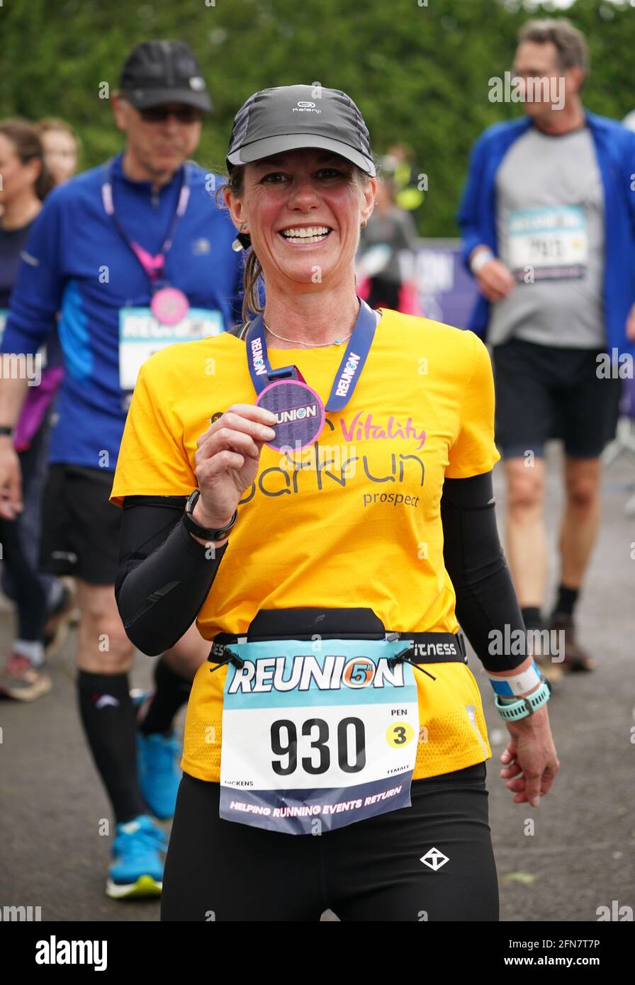 A runner with a medal after taking part in the Reunion 5k run at ...