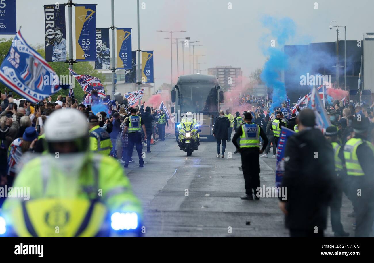 Rangers fans cheer as the team bus arrives outside the ground before ...