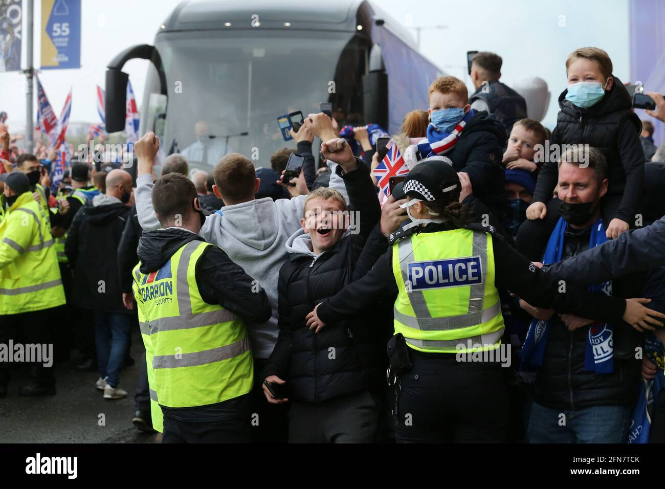 Rangers fans cheer as the team bus arrives outside the ground before ...