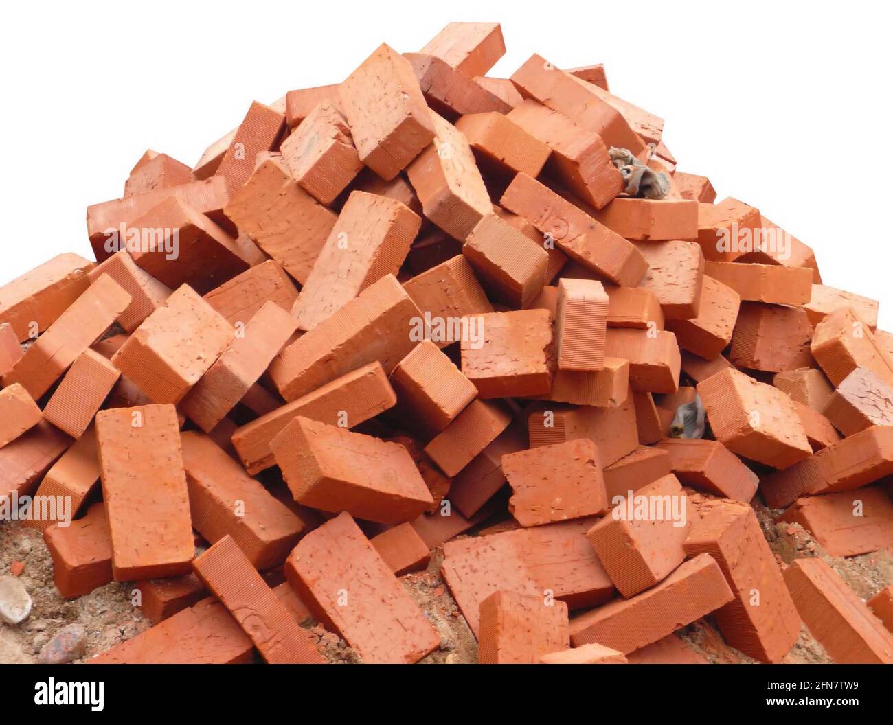 heap of red brick at day isolated Stock Photo - Alamy