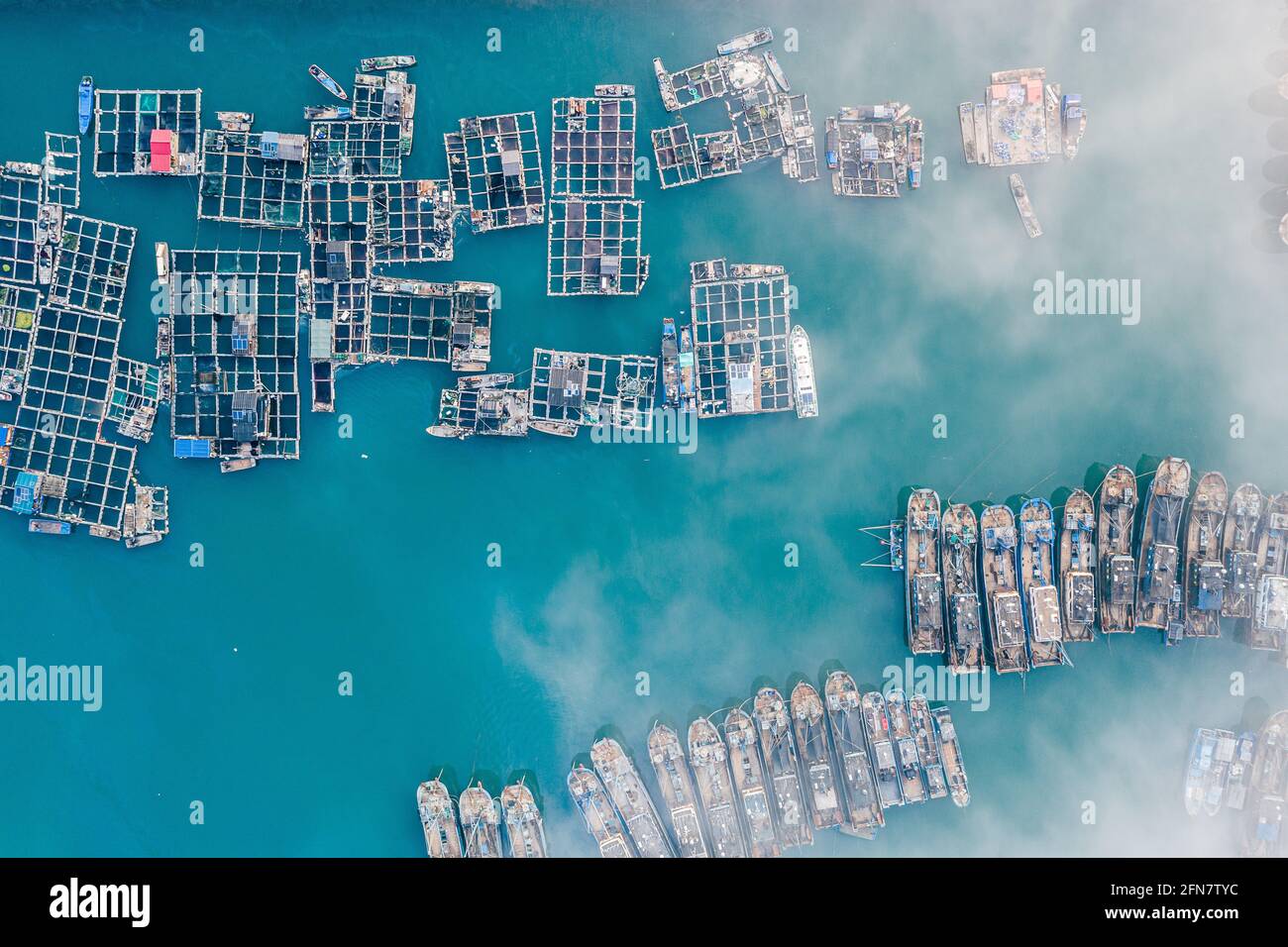 Aerial view of rows of fishing raft and fishing boats on the port Stock ...