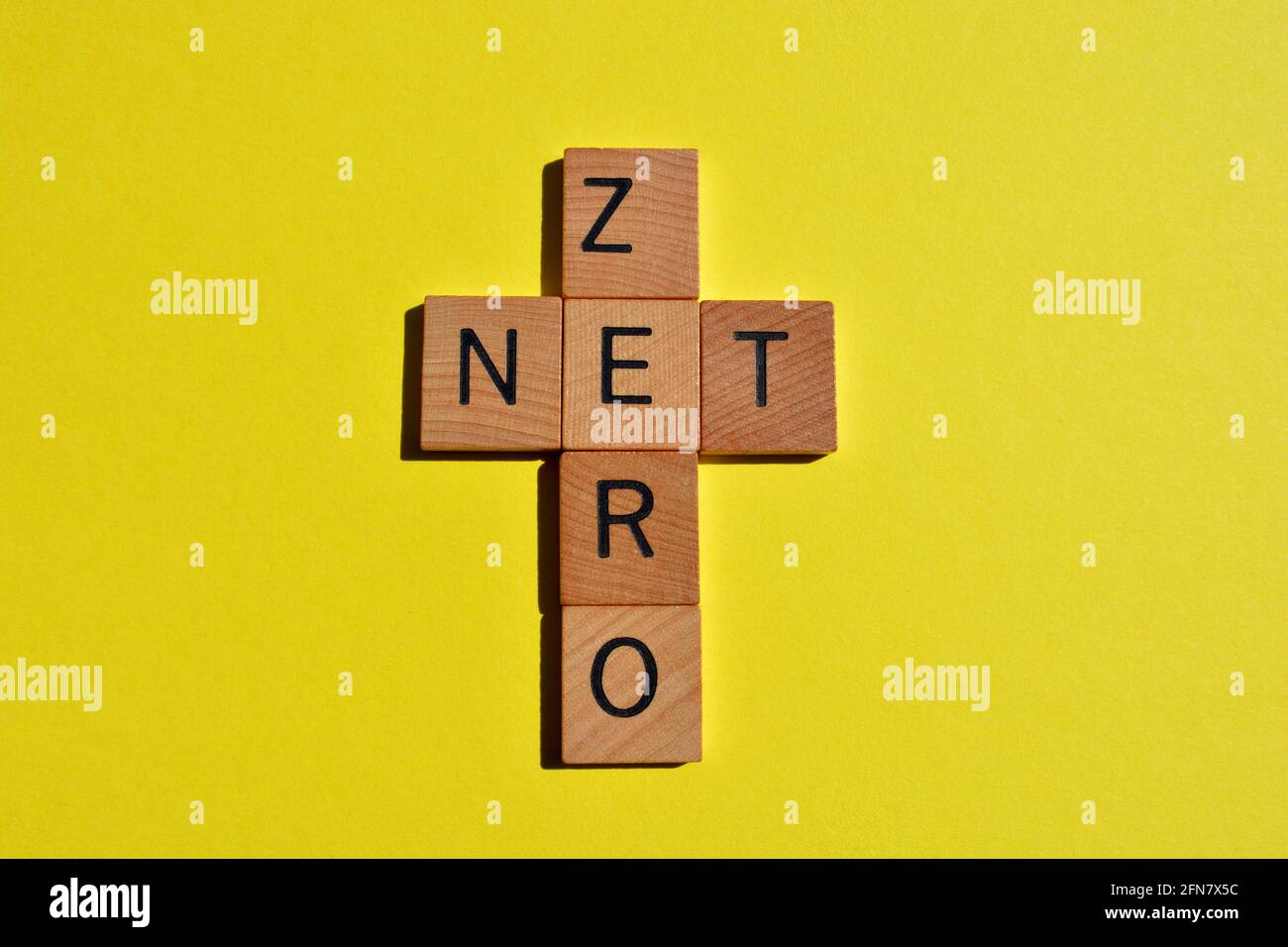 Net Zero, word in crossword form isolated on yellow background Stock ...