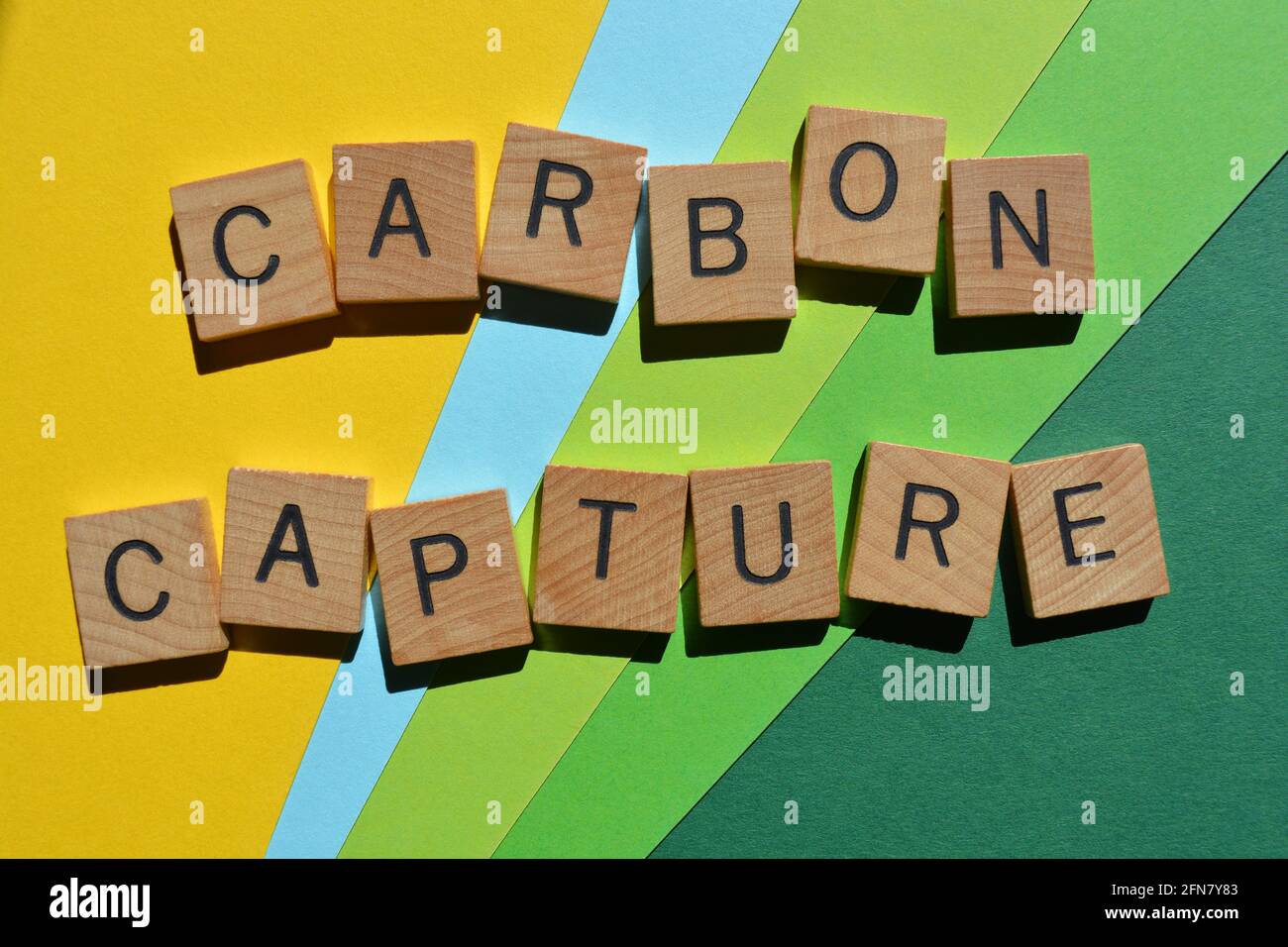 Carbon Capture, words in wooden alphabet letters isolated on green ...