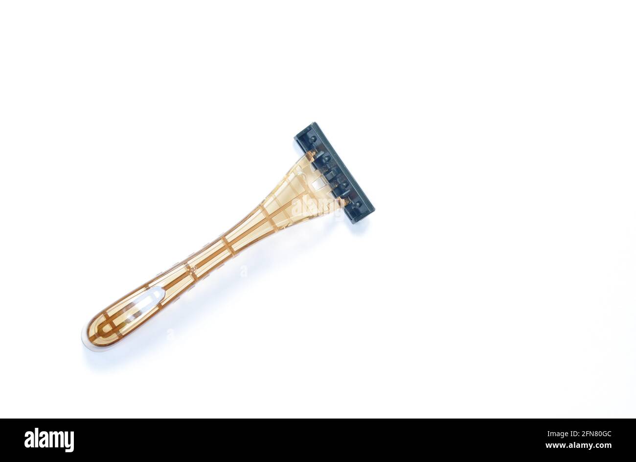 green plastic shaver arranging on white background Stock Photo - Alamy