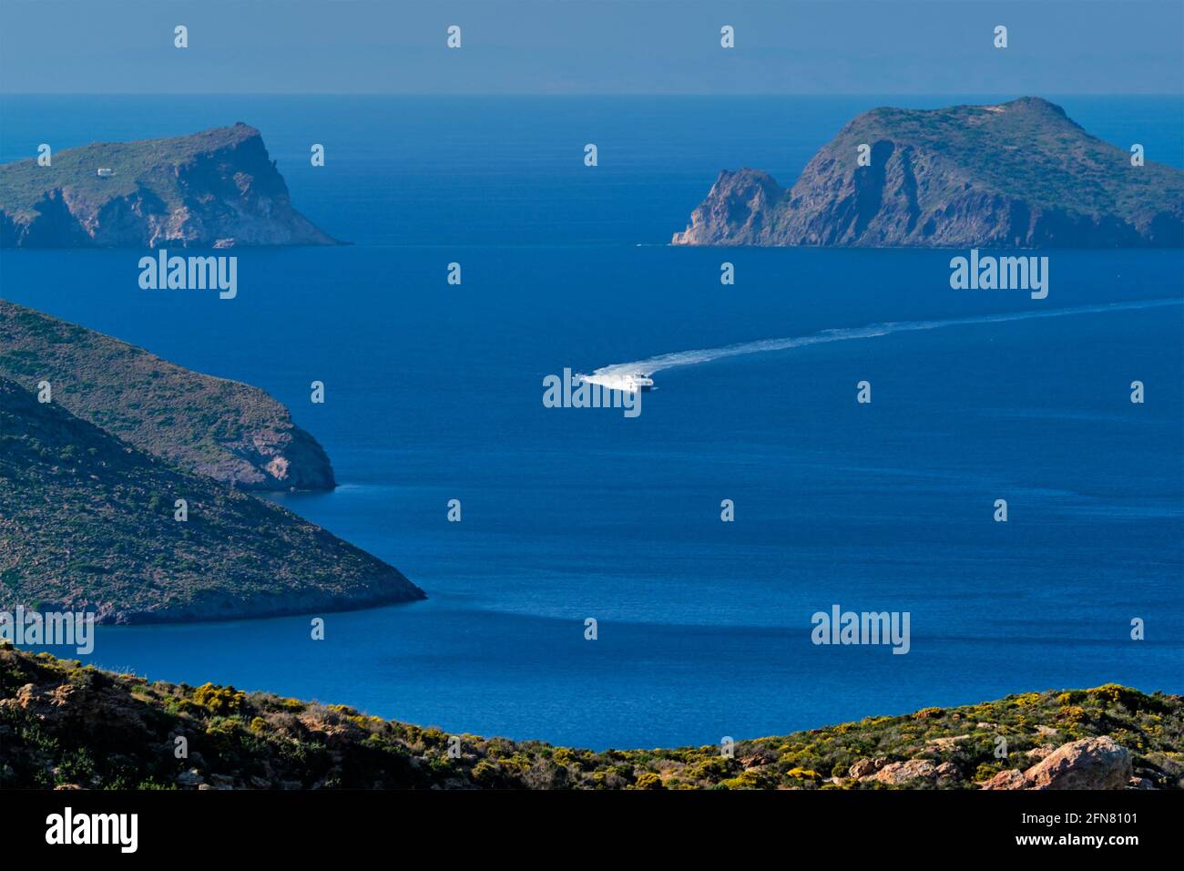 Speeding speed boat catamaran ship in Aegean sea near Milos island in ...