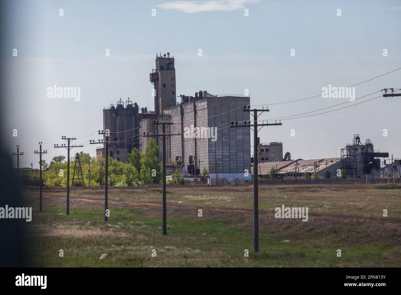 Outdated Soviet concrete grain elevator. Partially destroyed. Clear ...