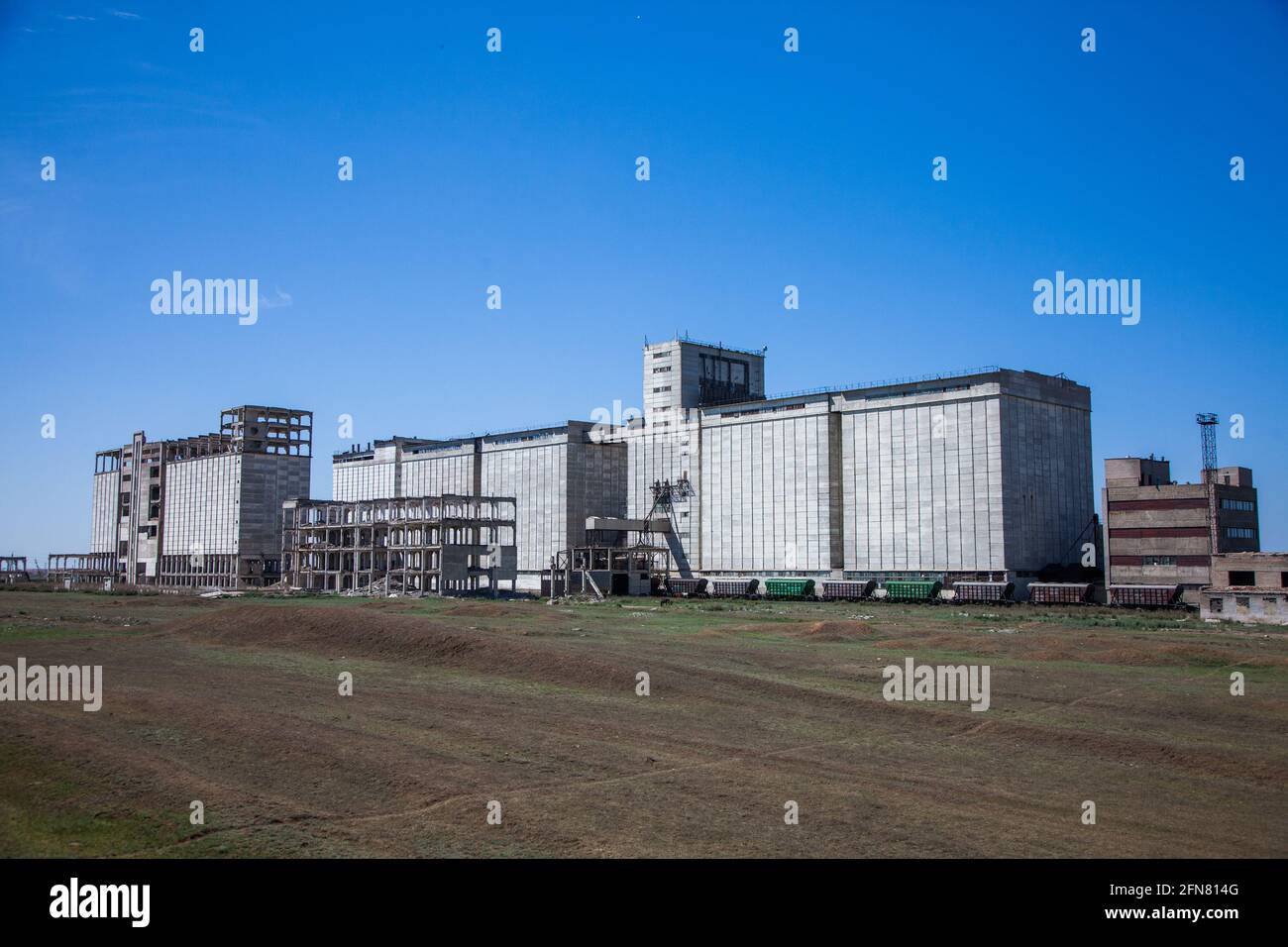 Outdated Soviet concrete grain elevator. Partially destroyed buildings ...