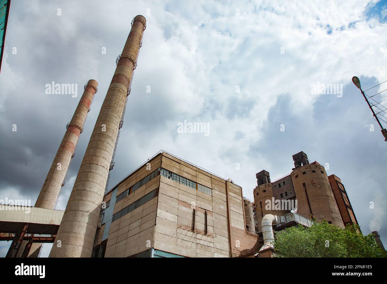 Temirtau, Kazakhstan: Old outdated Soviet cement plant smoking stack ...