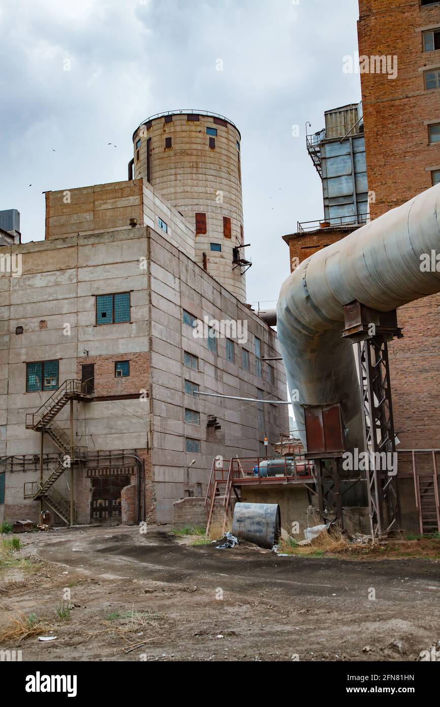 Temirtau,Kazakhstan: Old outdated Soviet cement plant. Metal grey tube ...