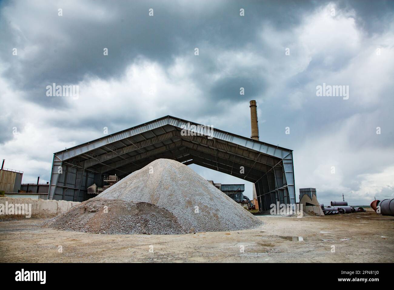 Temirtau, Kazakhstan: Outdated Soviet cement plant. Metal hangar (roof ...