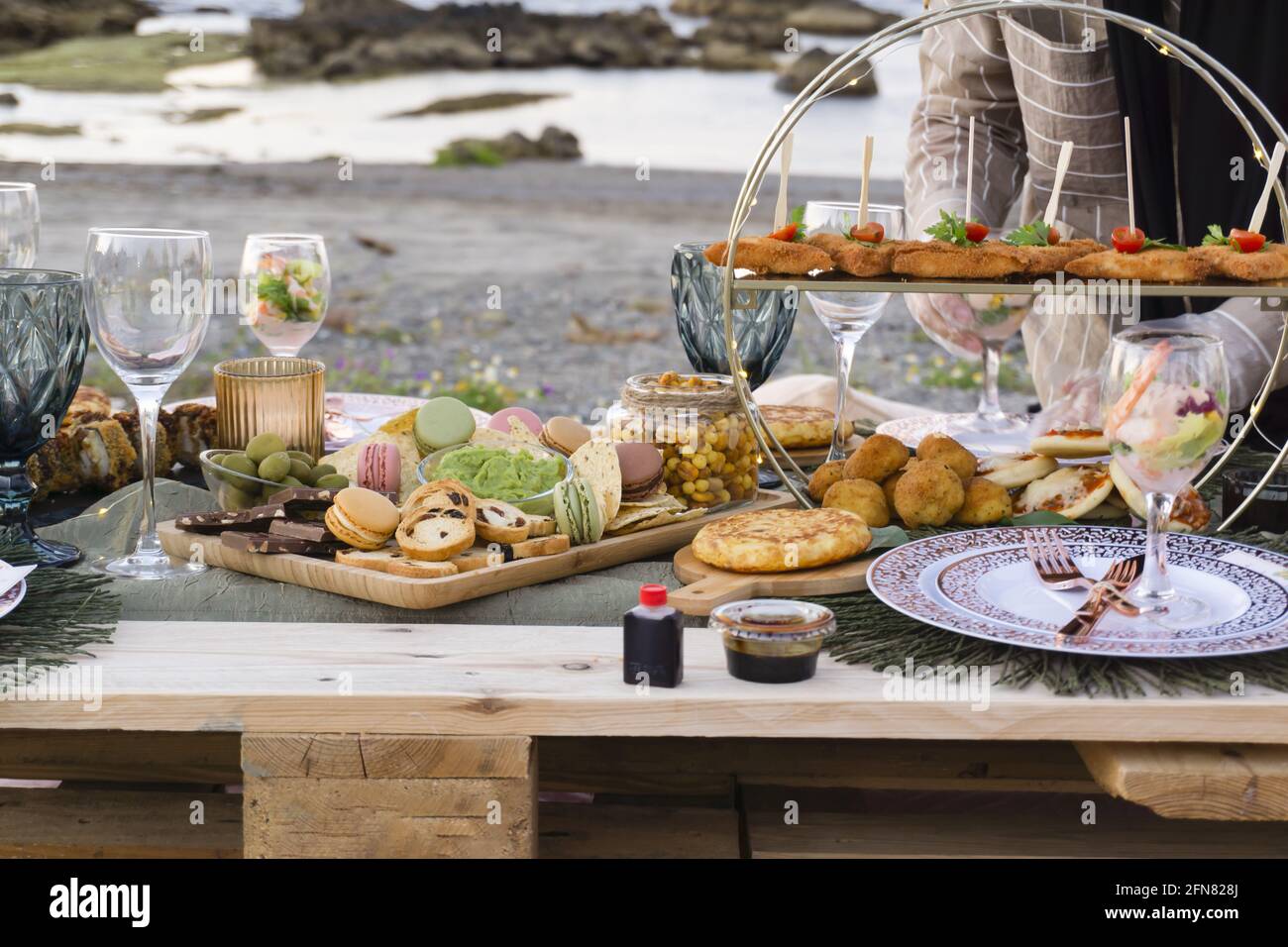 Picnic table full of appetizing foods, wonderful evening on the sunny ...