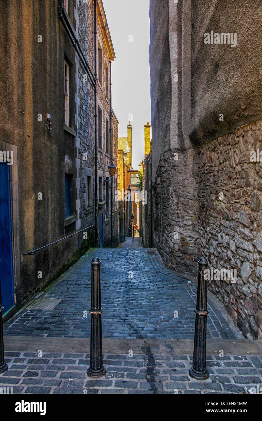 A cobbled alleyway with traditional lanterns in the Old Town of ...