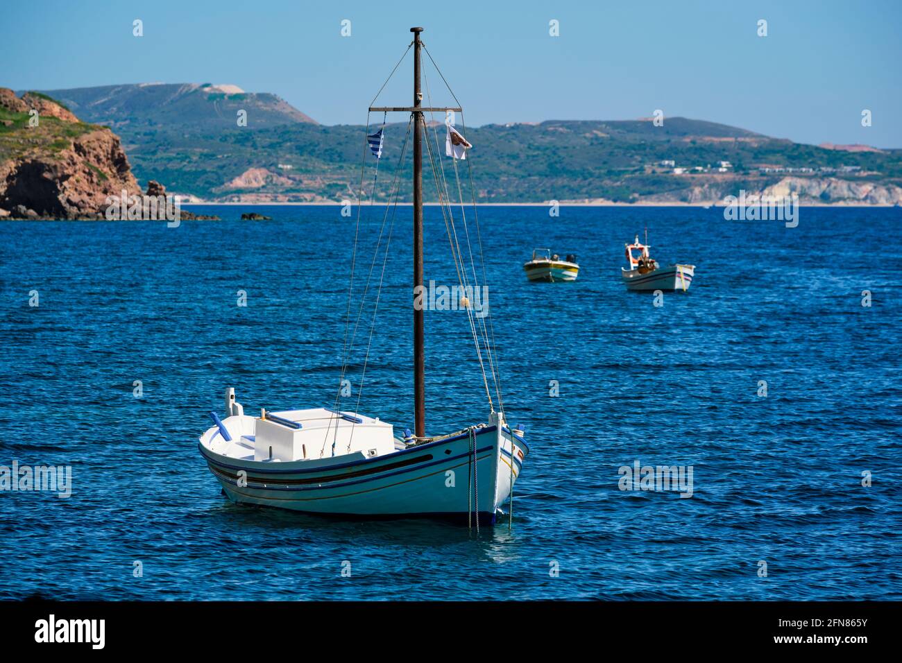 Traditional greek fishing boat in the aegean sea, Greece Stock Photo ...