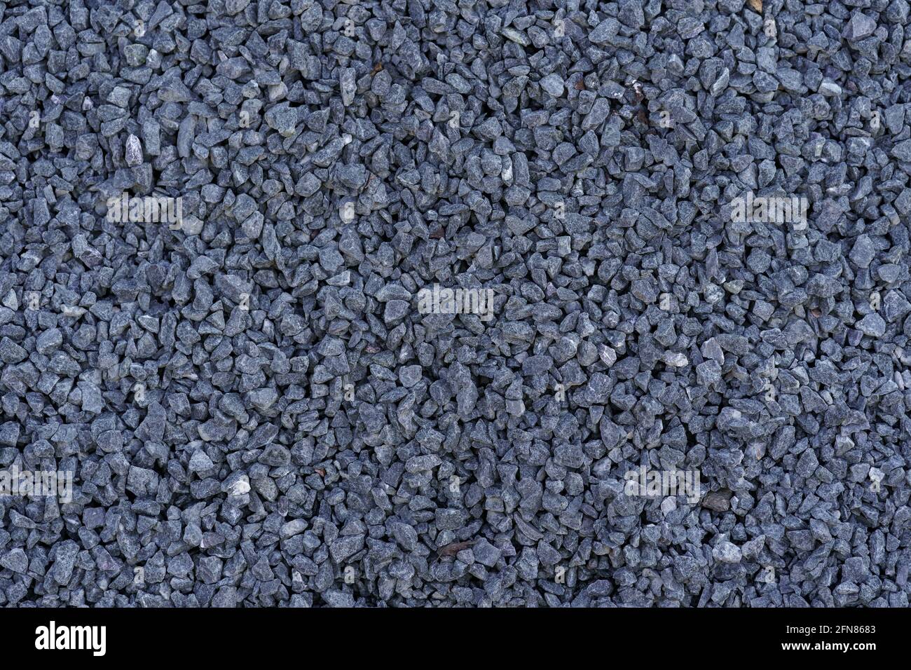 Gray small rocks ground texture. Dark gray small road stone background ...