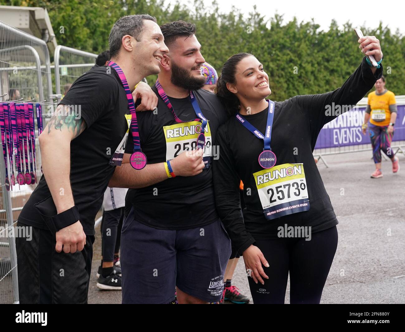 Runners after taking part in the Reunion 5k run at Kempton Park, London ...