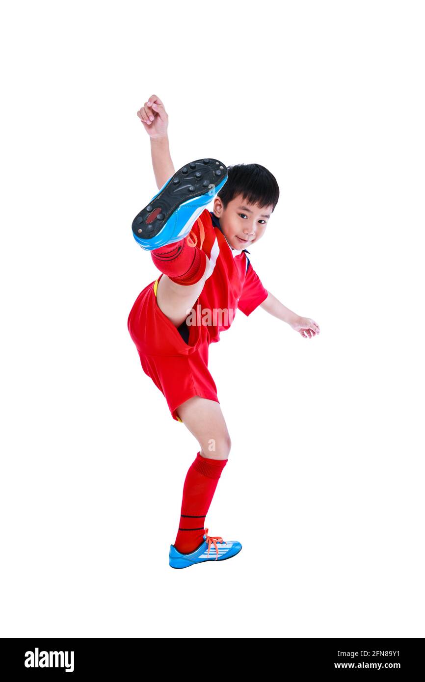 Full body portrait of playful young asian soccer player in red uniform ...