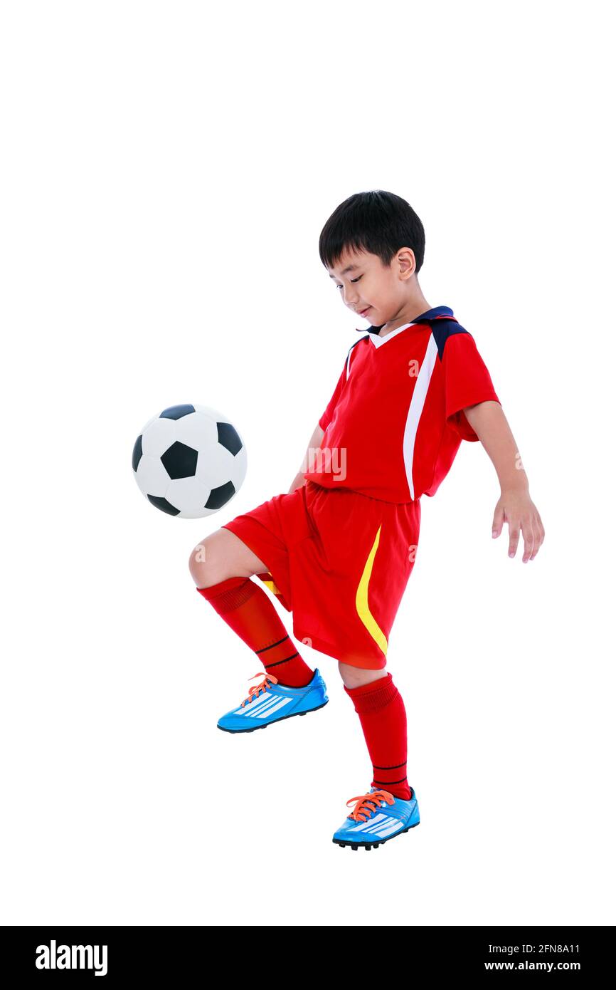 Full length portrait of happy asian soccer player in red uniform bounce ...