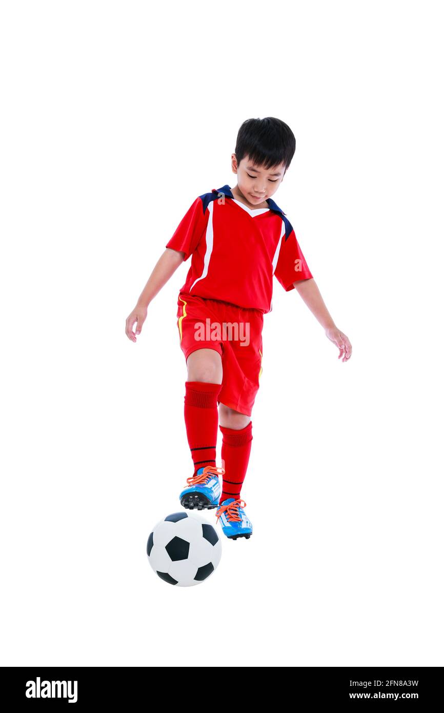 Full length portrait of happy asian soccer player in red uniform ...